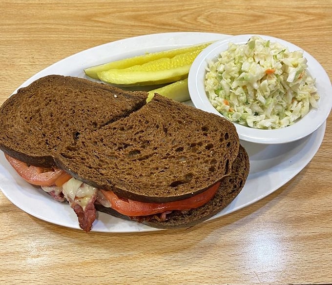 Dark rye, meet hot pastrami &ndash; it's a match made in deli heaven. This sandwich is stacked higher than your grandpa's stories about "the good old days."