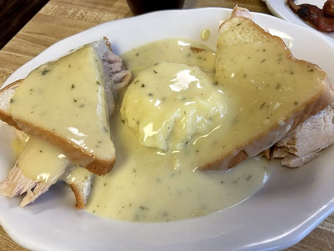 Hot turkey sandwich that doesn't mess around&mdash;tender turkey blanketed in homestyle gravy that cascades over bread islands like delicious lava. Comfort food, defined.