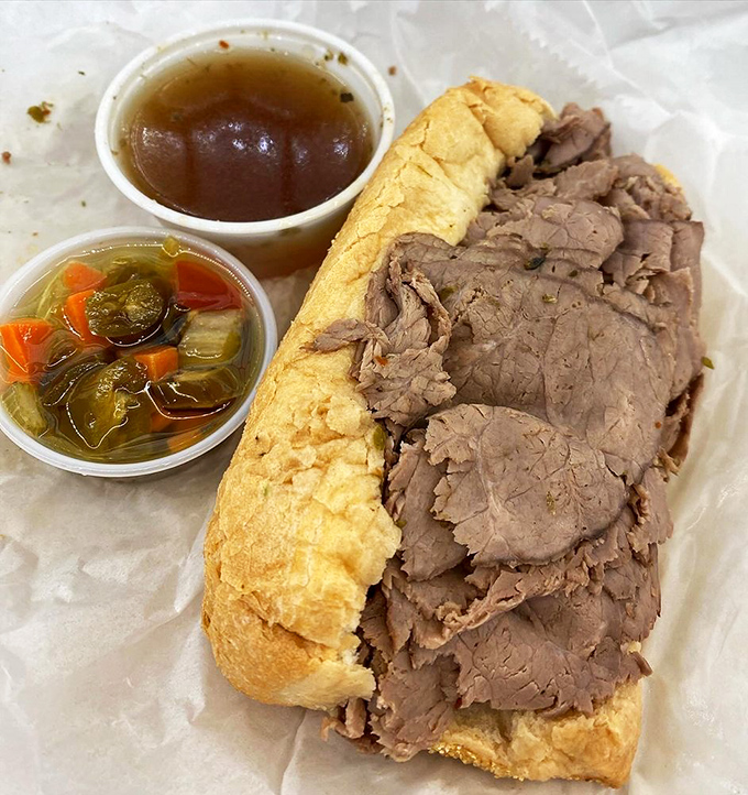 Behold the Italian beef in its natural habitat: thinly sliced, perfectly seasoned, with giardiniera and jus for dipping.