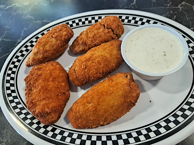 Golden-brown jalape&ntilde;o poppers that crunch like autumn leaves, revealing a molten center that dances between spicy and creamy.