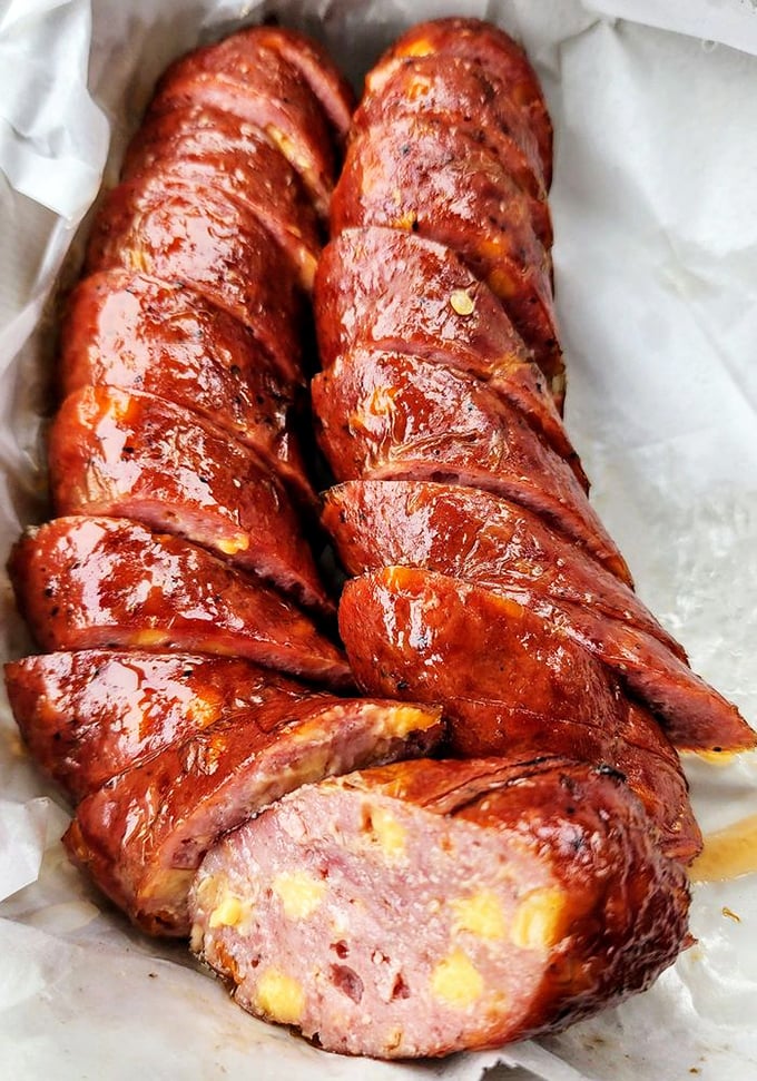 Sausage sliced to reveal that perfect snap-yielding-to-juicy interior, with cheese pockets that create little flavor explosions in every bite.