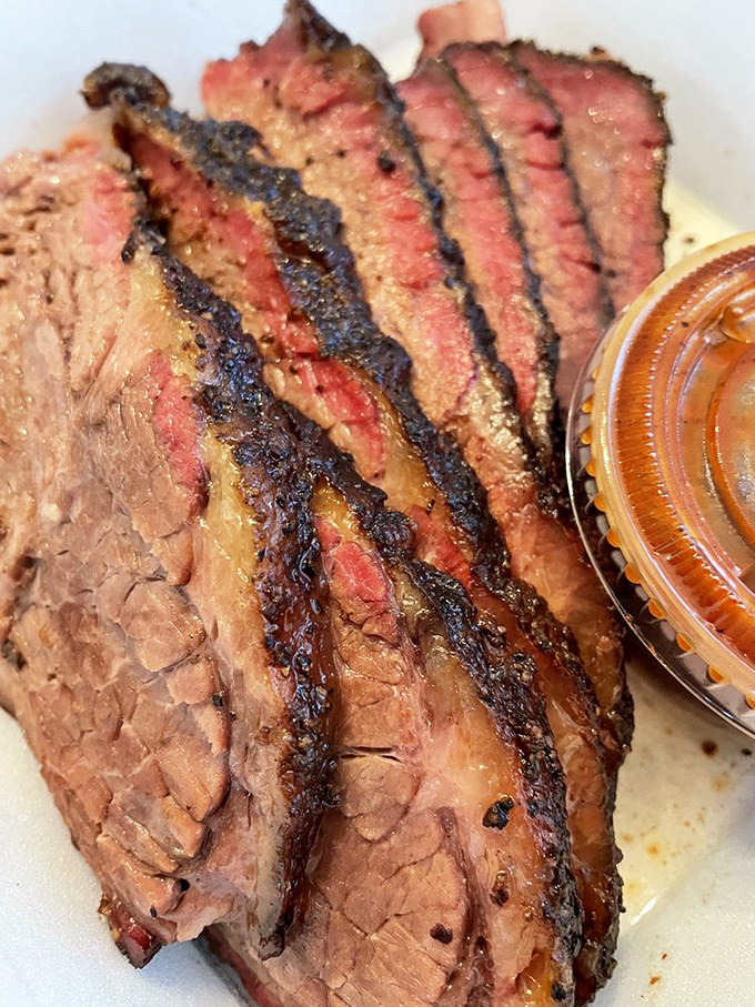 The mark of truly transcendent brisket isn't just the smoke ring&mdash;it's that perfect balance between bark and tenderness that makes time stand still.