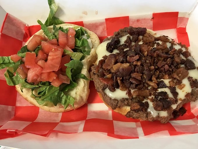 Fresh veggies and bacon atop a juicy burger—proof that sometimes the classics need no improvement. Simple ingredients, extraordinary results.