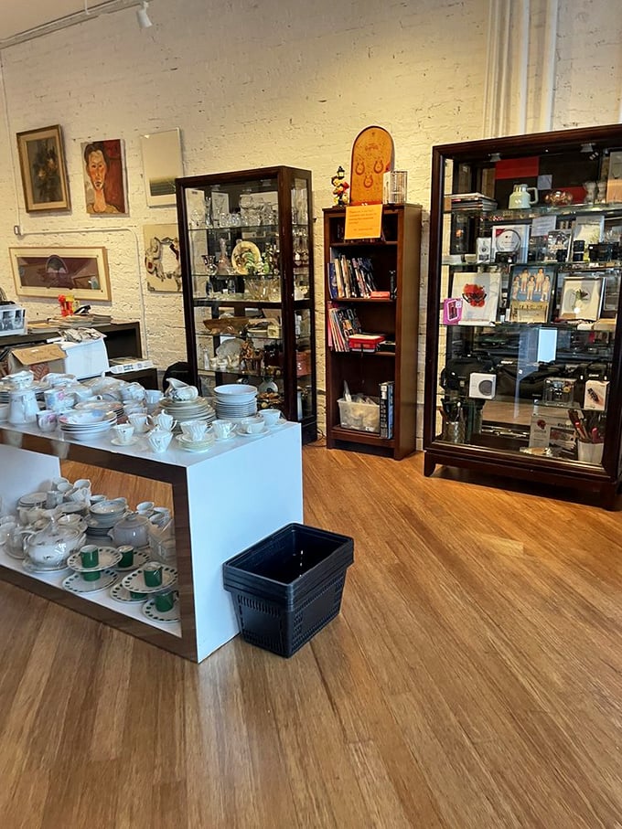 Teacups and saucers await new homes, arranged like delicate artifacts from the lost civilization of Dinner Parties Past.