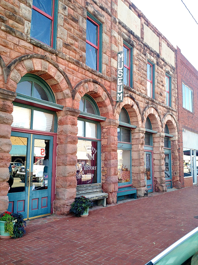 The Lincoln County Museum's rustic sandstone facade and arched windows invite history buffs to step back into territorial Oklahoma.