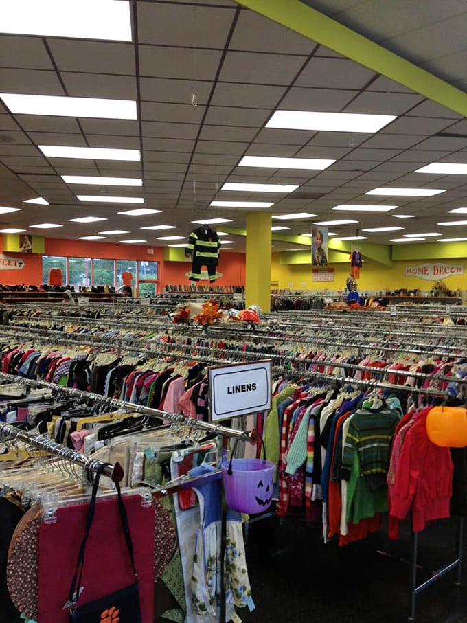The linens section stretches toward the horizon like a fabric sea. Someone's grandmother's tablecloth could become your vintage statement piece.