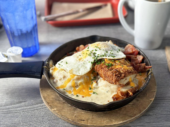 This skillet doesn't just break fast&mdash;it shatters expectations. Cheese cascading over crispy potatoes like a dairy waterfall with an egg sun rising above.