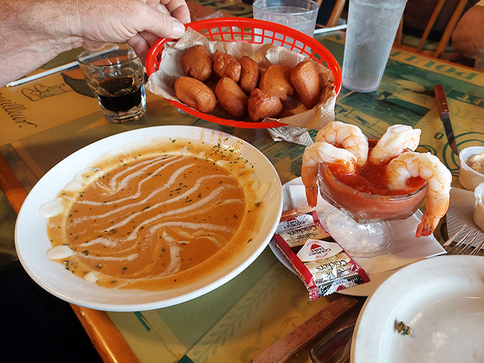 Lobster bisque so rich it probably has its own offshore bank account. Those hushpuppies aren't staying quiet about how good they are.