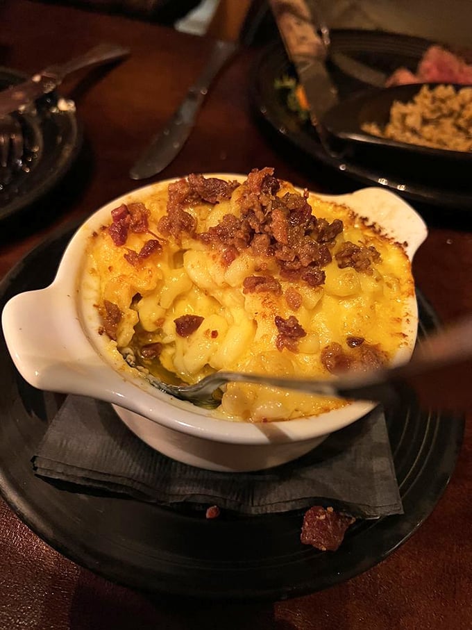Mac and cheese that's achieved enlightenment. That crispy bacon topping isn't just garnish—it's the crown jewels of comfort food royalty.