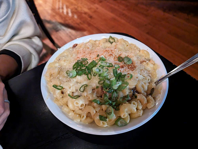 Mac and cheese that doesn't come from a blue box? Revolutionary. This creamy cavatappi masterpiece, topped with scallions, is comfort food elevated to art form.