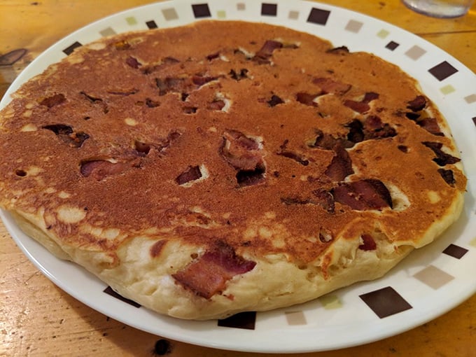 The "Meat Cake" pancake isn't messing around&mdash;bacon embedded in fluffy buttermilk batter creates breakfast's answer to the turducken. Genius!
