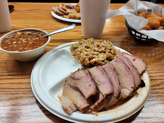 Sliced pork shoulder with that telltale pink smoke ring. The barbecue equivalent of finding an original Picasso in your grandma's attic.