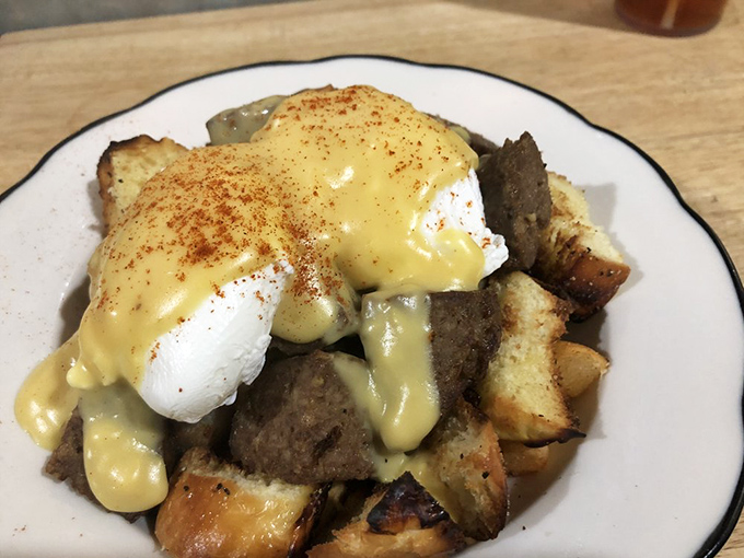 Breakfast reimagined as an edible treasure hunt. Each forkful offers a different combination of flavors, with that hollandaise sauce tying everything together like a culinary conductor.