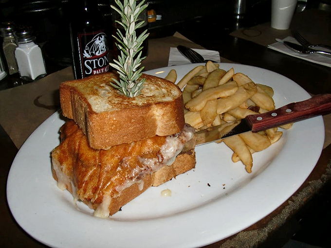 The sandwich that ate San Diego. Three slices of bread barely contain what might be the most ambitious meatloaf construction project since the Hoover Dam.