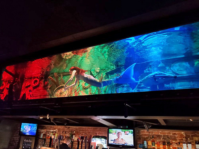 Where else can you sip a cocktail while watching a mermaid gracefully swim overhead? It's dinner theater for the Jacques Cousteau crowd.