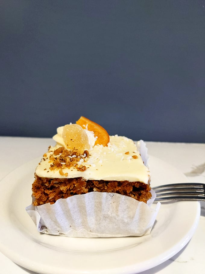 If moistness were measured on a scale of 1-10, this carrot cake breaks the equipment. The cream cheese frosting-to-cake ratio achieves mathematical perfection.