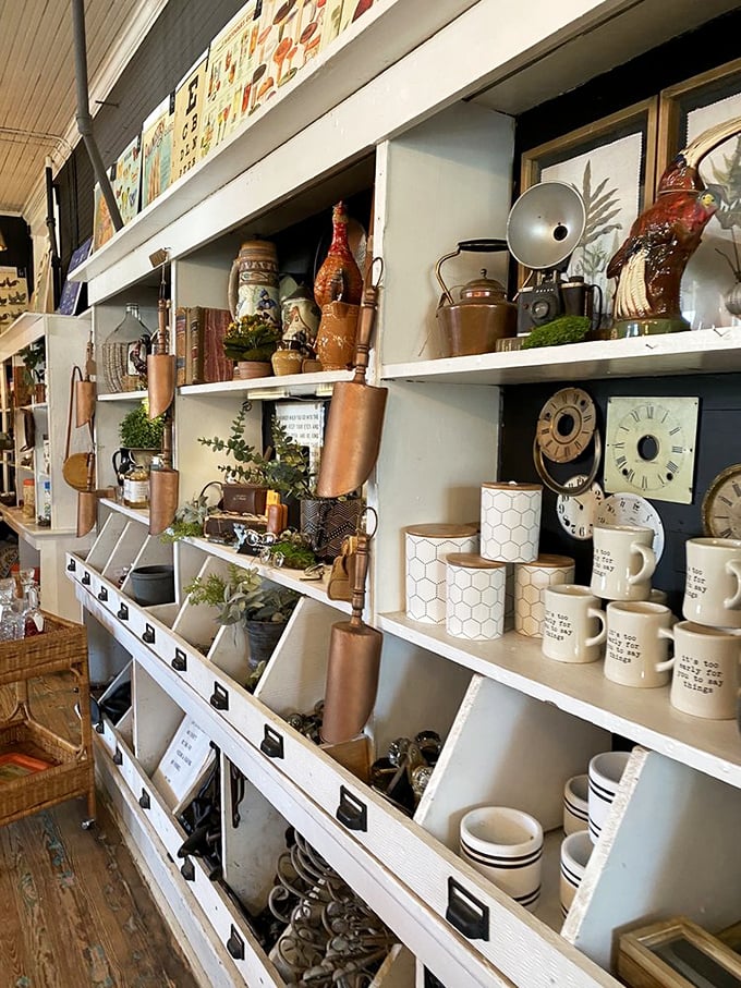 The mug wall&mdash;where morning coffee vessels await adoption. That vintage rooster might be judging your beverage choices, but the pottery won't.