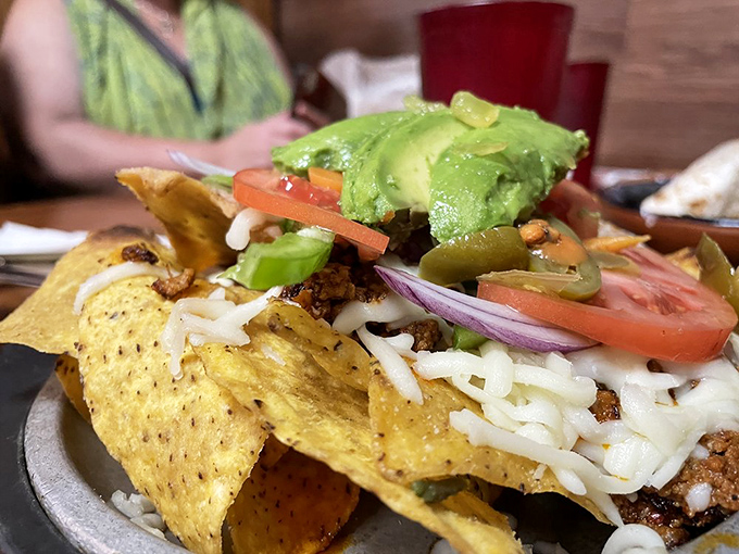 Layer upon delicious layer &ndash; these nachos aren't the sad stadium variety but a mountain of flavor with fresh toppings that make sharing nearly impossible.