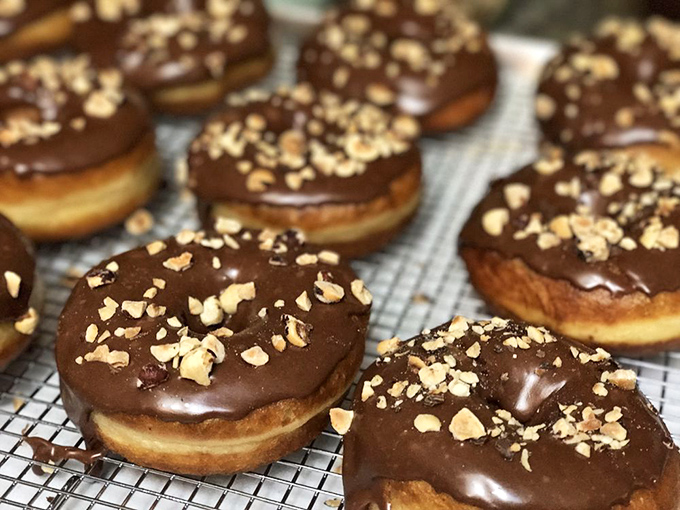 These chocolate-glazed donuts with hazelnuts aren't just dessert&mdash;they're what would happen if Nutella evolved into its final form.