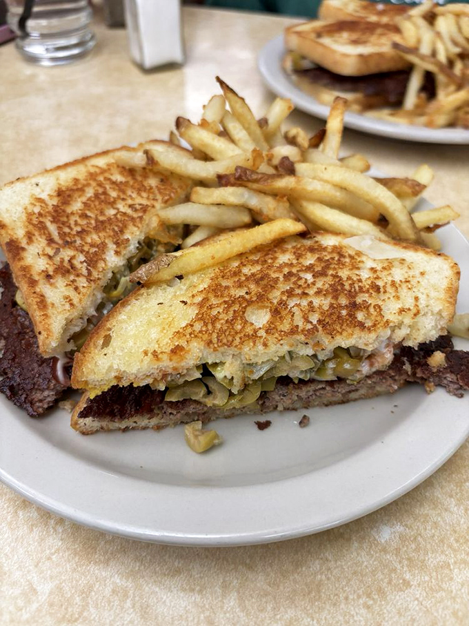 The patty melt—that glorious intersection where grilled cheese meets burger and everything just makes sense in the world again.