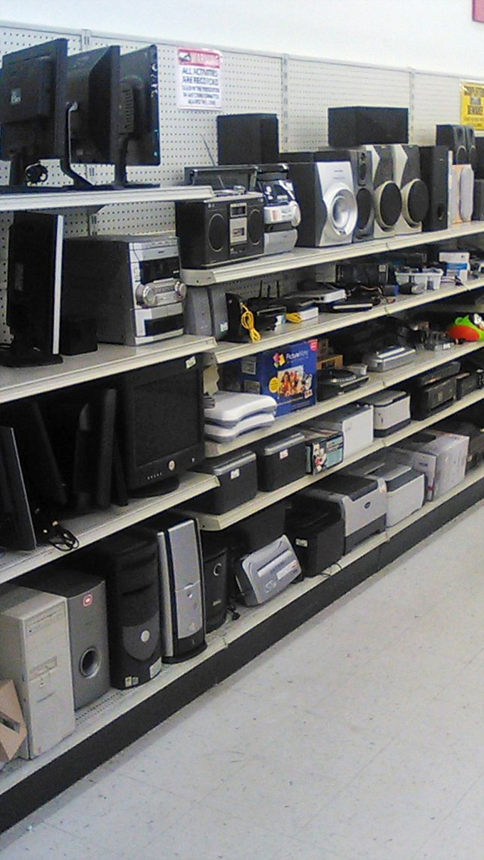 The electronics aisle&mdash;a museum of technological evolution where forgotten desktop towers and sound systems wait for their second act.