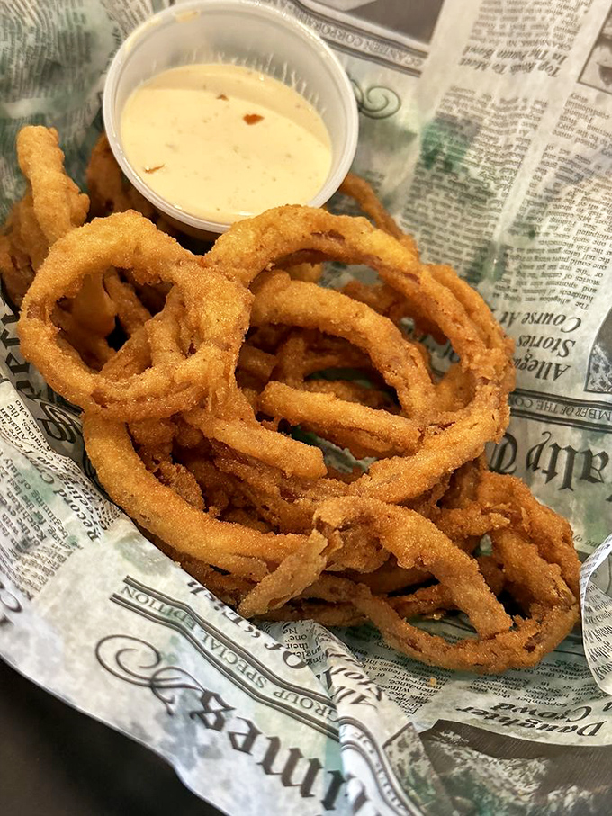 Golden halos of onion perfection waiting for their baptism in creamy dip&mdash;vegetables that have achieved their highest calling in life.