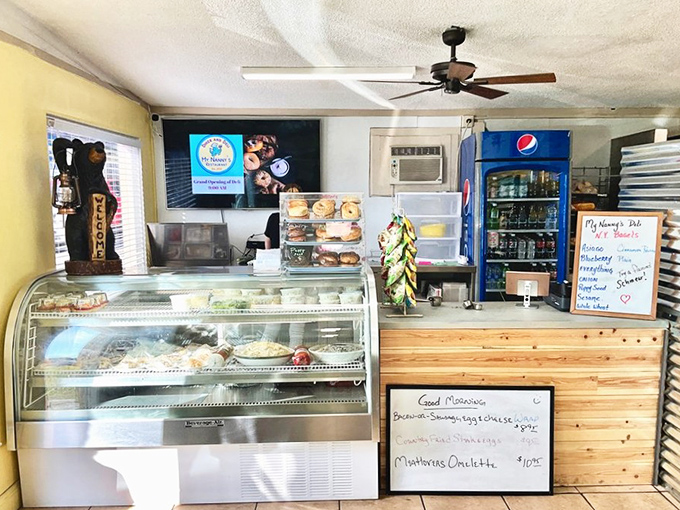 Diner paradise: where the display case doubles as a portal to happiness. The wooden counter and handwritten specials board say, "Trust us, we know what we're doing."