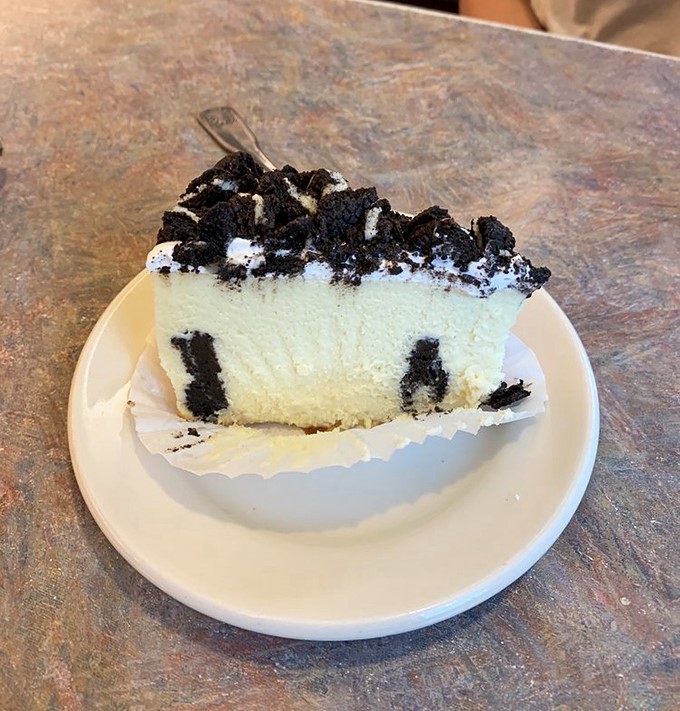 Oreo cheesecake that makes you want to cancel your afternoon plans in favor of a nap and sweet dreams about this black-and-white masterpiece.