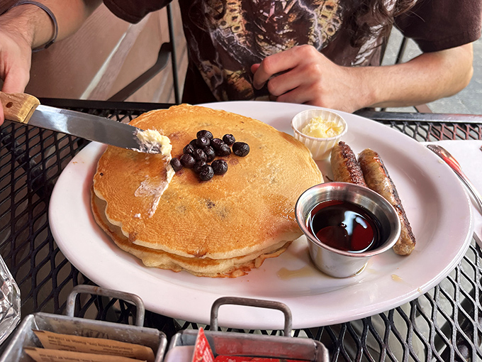The pancake that launched a thousand road trips. That golden disc with fresh blueberries is why alarm clocks were invented.