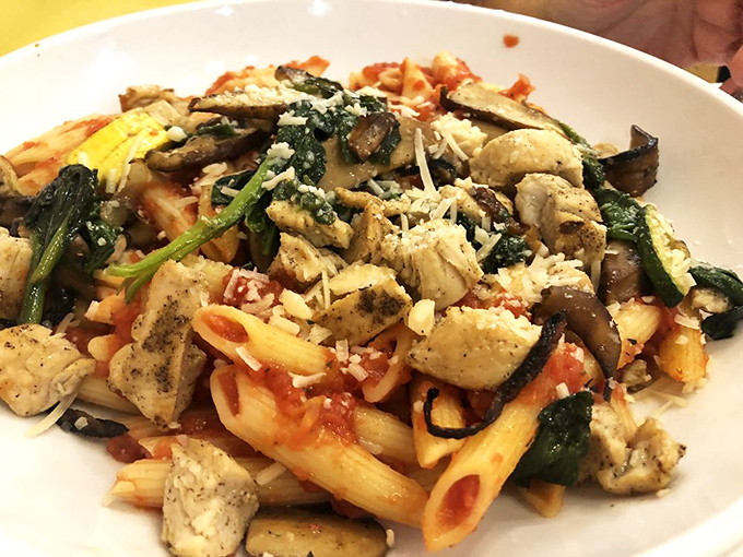 Pasta that's having a party and invited all the right guests: blackened chicken, fresh vegetables, and enough cheese to make Italy jealous.