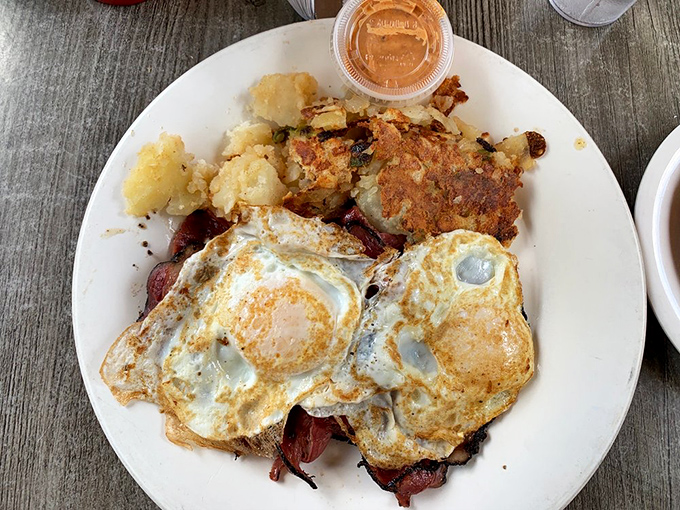 Eggs lounging atop a bed of pastrami with home fries standing guard&mdash;a New York breakfast alliance that's been protecting appetites for generations.