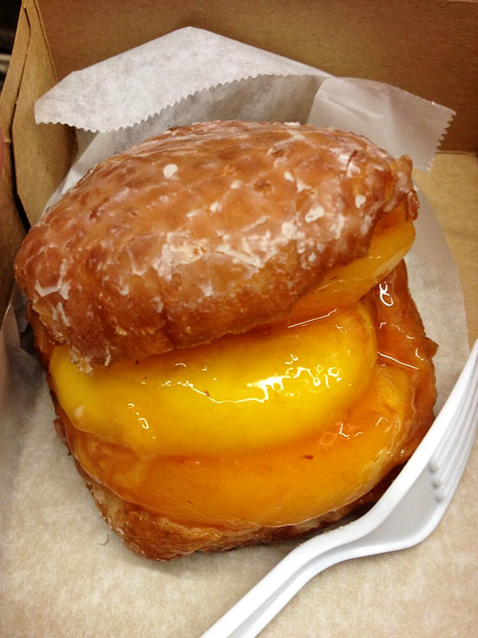 The peach donut: where summer fruit meets fried dough in a sticky, glorious union. It's like biting into sunshine with a glaze chaser.