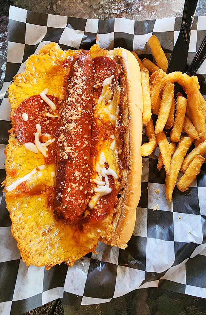 Pizza meets hot dog in a culinary mashup that shouldn't work but absolutely does. The crispy cheese "skirt" is pure genius.