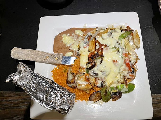 The Pollo Santa Fe arrives like a work of art&mdash;cheese cascading over grilled chicken and vegetables with a foil-wrapped treasure on the side.