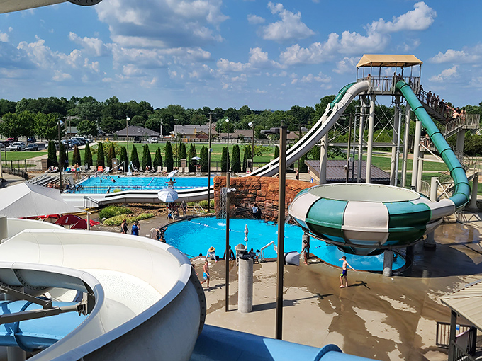 Water slides that laugh in the face of gravity, towering over pools of crystal blue. The architectural equivalent of "hold my drink and watch this."