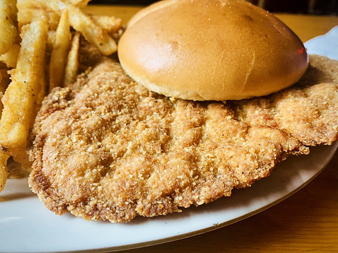 The pork tenderloin sandwich&mdash;where the meat heroically extends beyond the bun's borders. Midwestern portion sizes at their most magnificent.