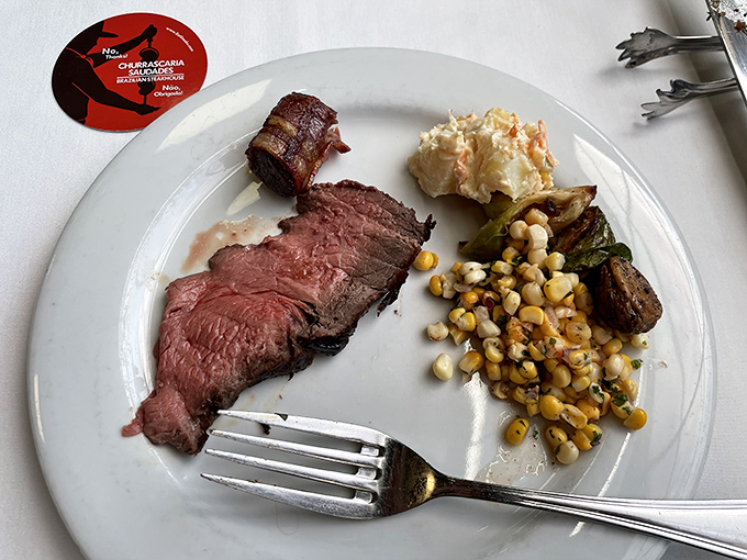 This slice of beef is so perfectly rare, it's practically having a conversation with your fork. The golden polenta beneath is its attentive audience.
