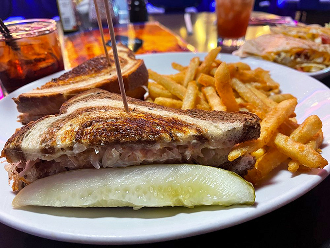 This isn't just a burger&mdash;it's a skyscraper of flavor with pastrami reaching for the heavens and fries standing guard like delicious sentinels.