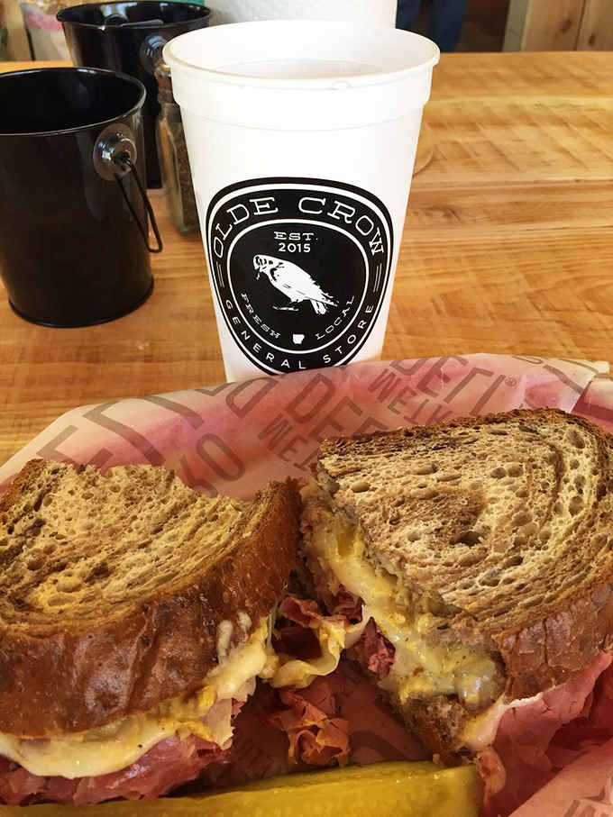 Behold the Reuben in its natural habitat &ndash; accompanied by a pickle spear and the knowledge that napkins will definitely be necessary.
