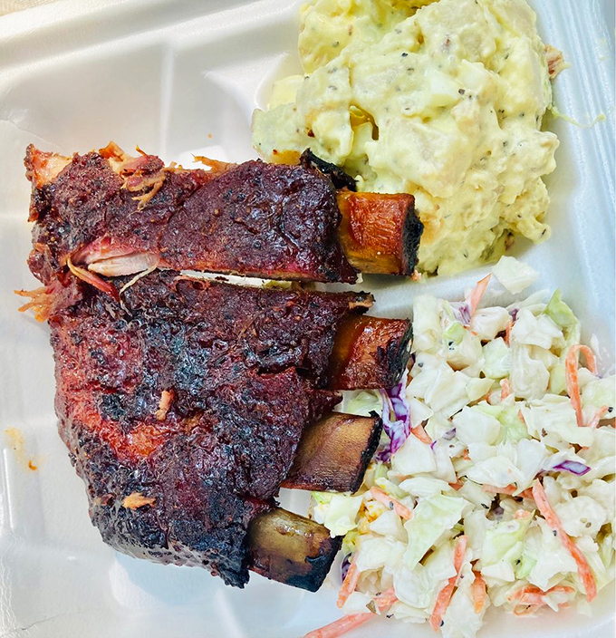 Ribs that would make Fred Flintstone weep with joy, paired with sides that refuse to be overshadowed.
