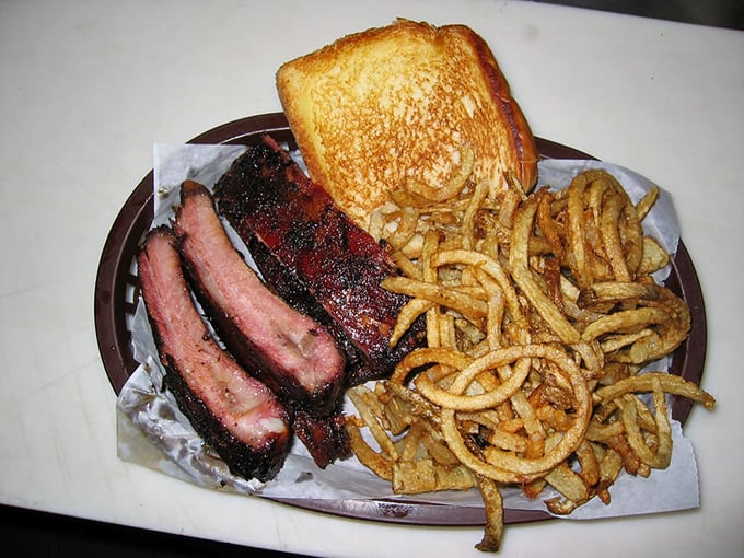 These ribs have that perfect "not-falling-off-the-bone" integrity barbecue aficionados crave, paired with curly fries that could double as edible slinkies.
