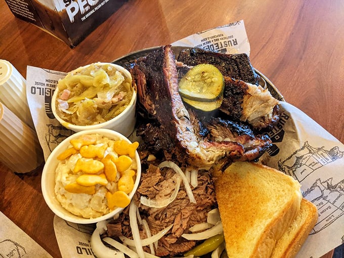 Meat candy for grown-ups. The smoke ring on these ribs tells a story of patience, while the cornbread stands by, ready for sauce-sopping duty.