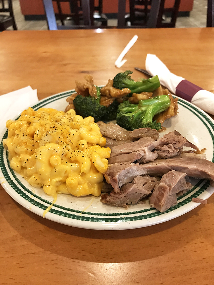 A plate that tells the story of American comfort meets Asian influence &ndash; mac and cheese cozying up to roast pork like old friends at a reunion.