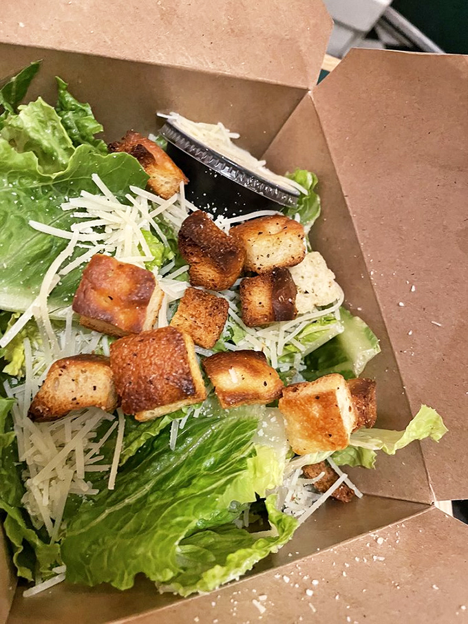 A classic pepperoni slice on a paper plate with a fountain soda&mdash;the lunch combo that's outlasted every food trend since disco.