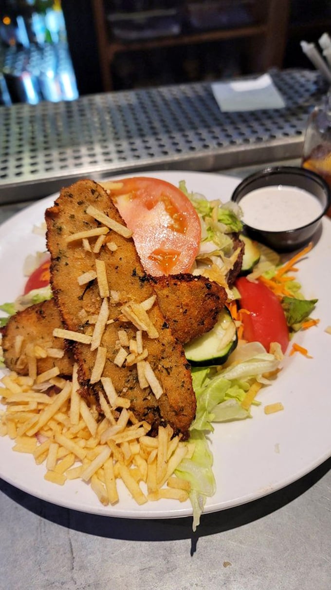 Even salads get the royal treatment—crispy chicken perched atop fresh greens with a sprinkle of cheese for good measure.
