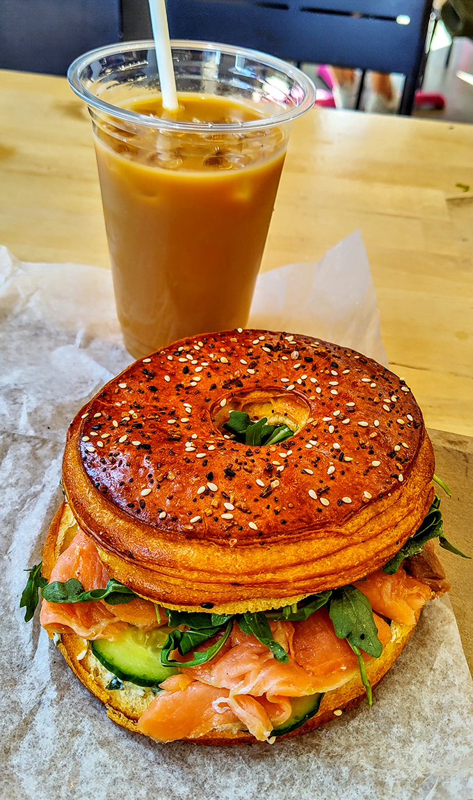 The salmon Cro'Gel sandwich alongside iced coffee &ndash; a pairing so perfect it deserves its own romantic comedy soundtrack.