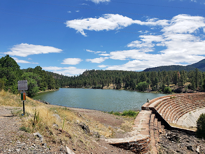 Santa Fe Reservoir's serene waters pull double duty: stunning views for visitors and vital water resources for locals. That amphitheater's waiting for your family's next adventure.