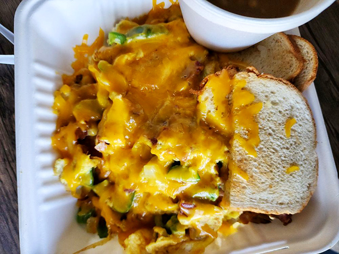 Meet the legendary Scrambler—where eggs, cheese, and vegetables unite in a yellow-hued mountain that's been curing hangovers and breaking Instagram since before Instagram existed.