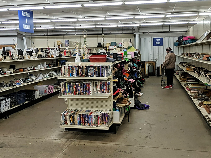 Between "Electrical & Hardware" and shelves of possibility, shoppers embark on their quest. The thrill of the hunt is universal.