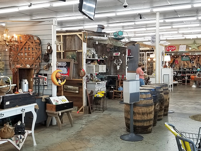 Each booth tells its own story, with rustic wooden displays and vintage barrels creating little neighborhoods of nostalgia throughout the sprawling space.